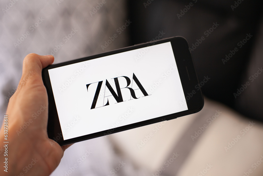 Zara logo on the screen of mobile phone. Inditex group brand identity ...