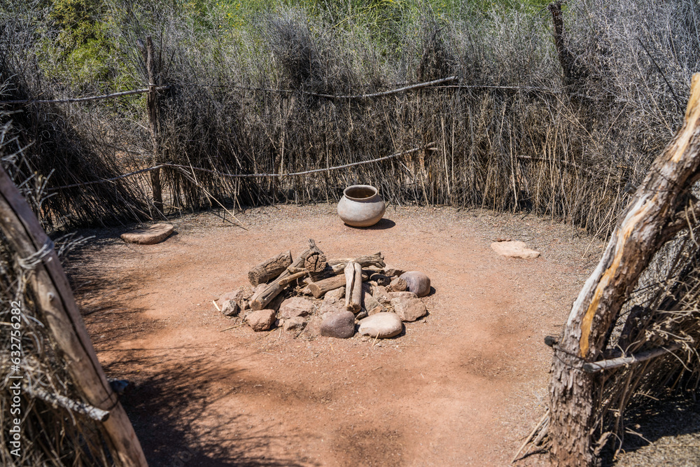 This image shows an ancient Native American campsite with a fire pit ...