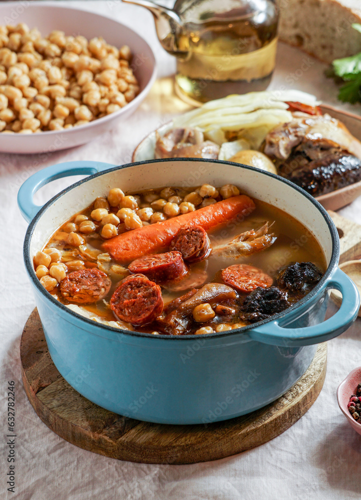Cocido Madrileño, a traditional Spanish meal, chickpea-based stew from ...