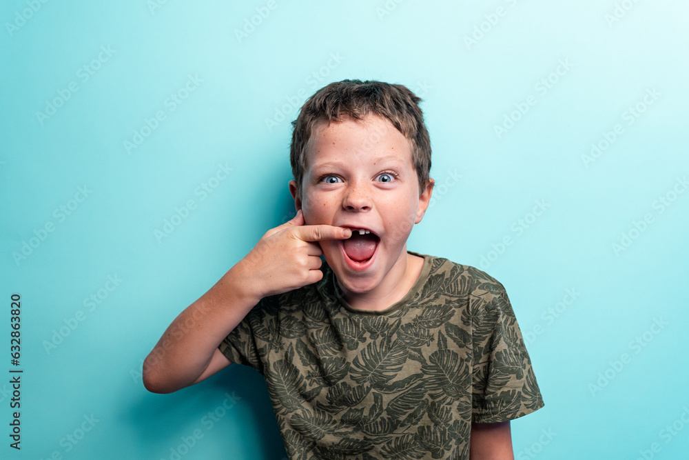 The kid lost a tooth. Baby without a tooth. Portrait of a little boy no ...