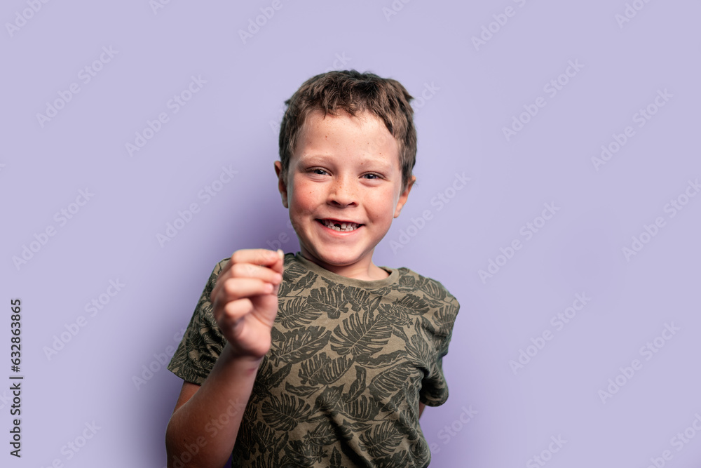 Kid losing his baby teeth. Boy with temporary baby tooth. Happy child ...