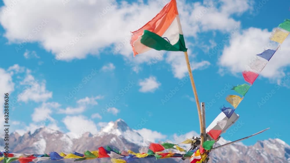 Indian flag waving in front of the Himalayan mountains in Padum town in ...