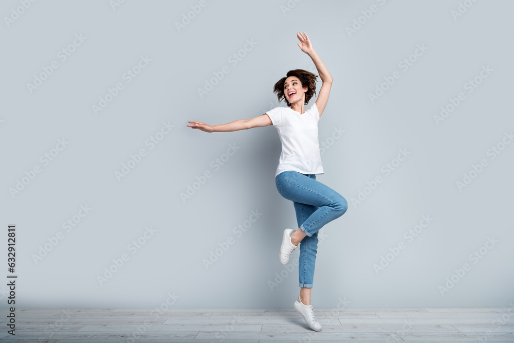 Full size portrait of lovely carefree cheerful girl enjoy dancing ...