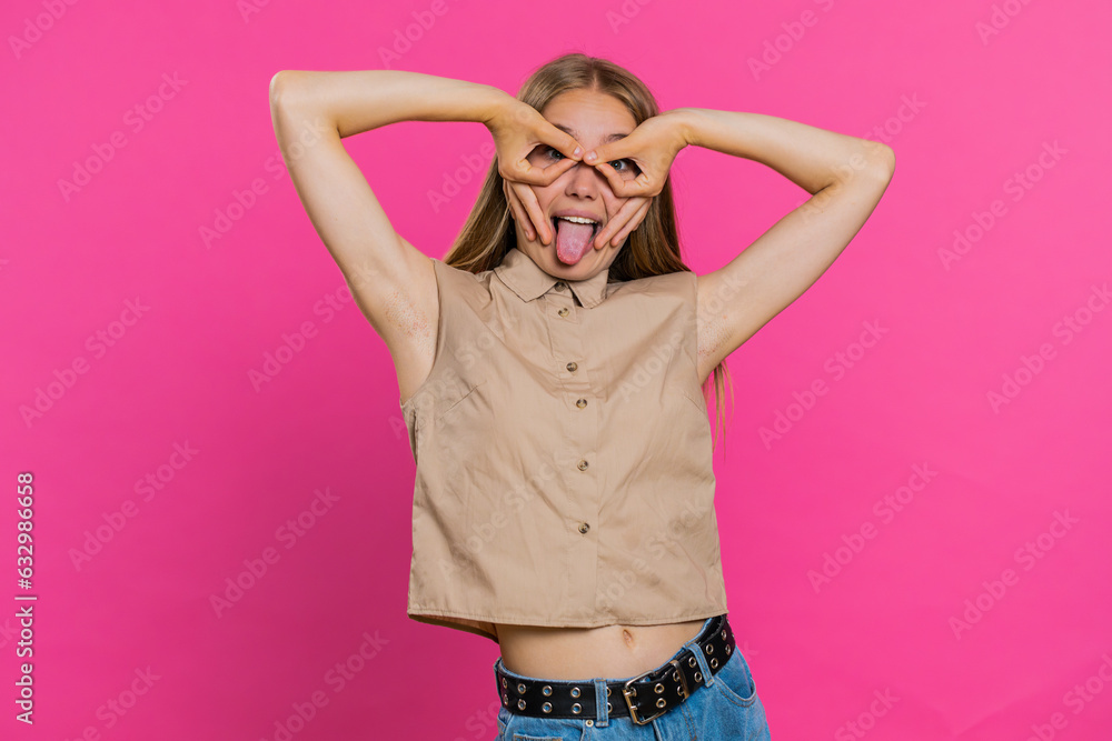 Funny comical playful young woman making silly facial expressions and ...