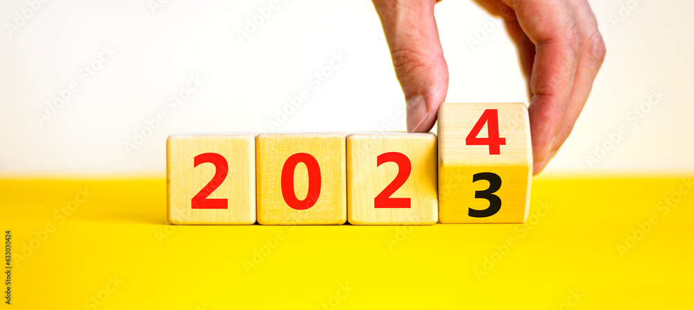 2024 happy new year symbol. Wooden cubes with number 2023 and 2024 ...