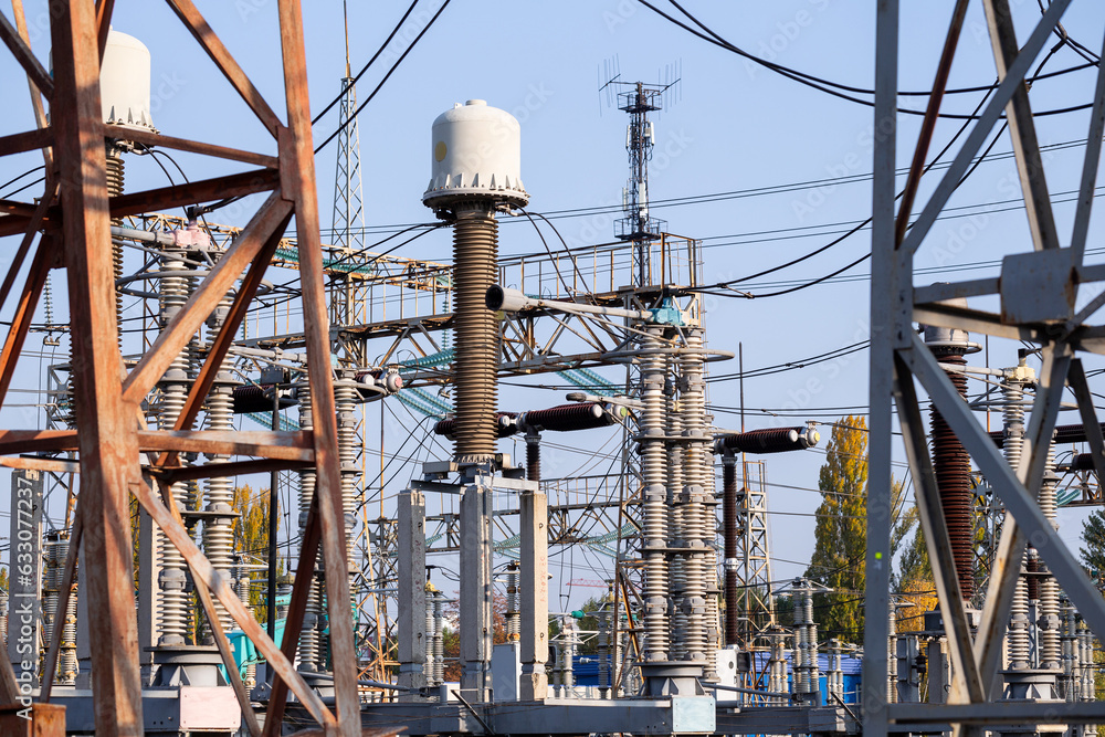 A high-voltage power electrical substation. Power lines, poles, ceramic ...
