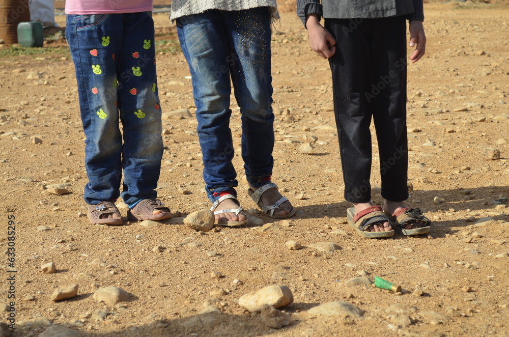 Syrian children with no proper shoes for winter Stock Photo | Adobe Stock