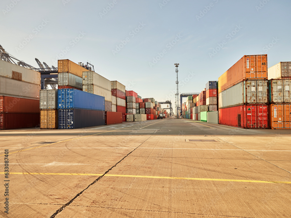 Shipping containers stacked up in docks on concrete, Felixstowe ...