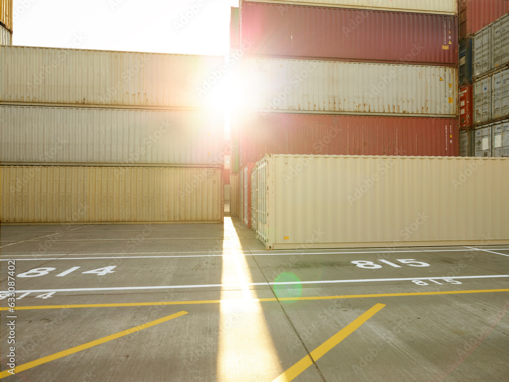Sunlight shining between shipping containers in docks, Felixstowe ...