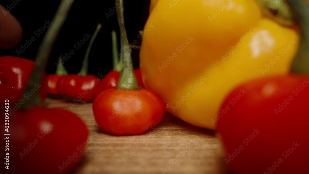 The camera moves backward along the table as I slowly gather together ...