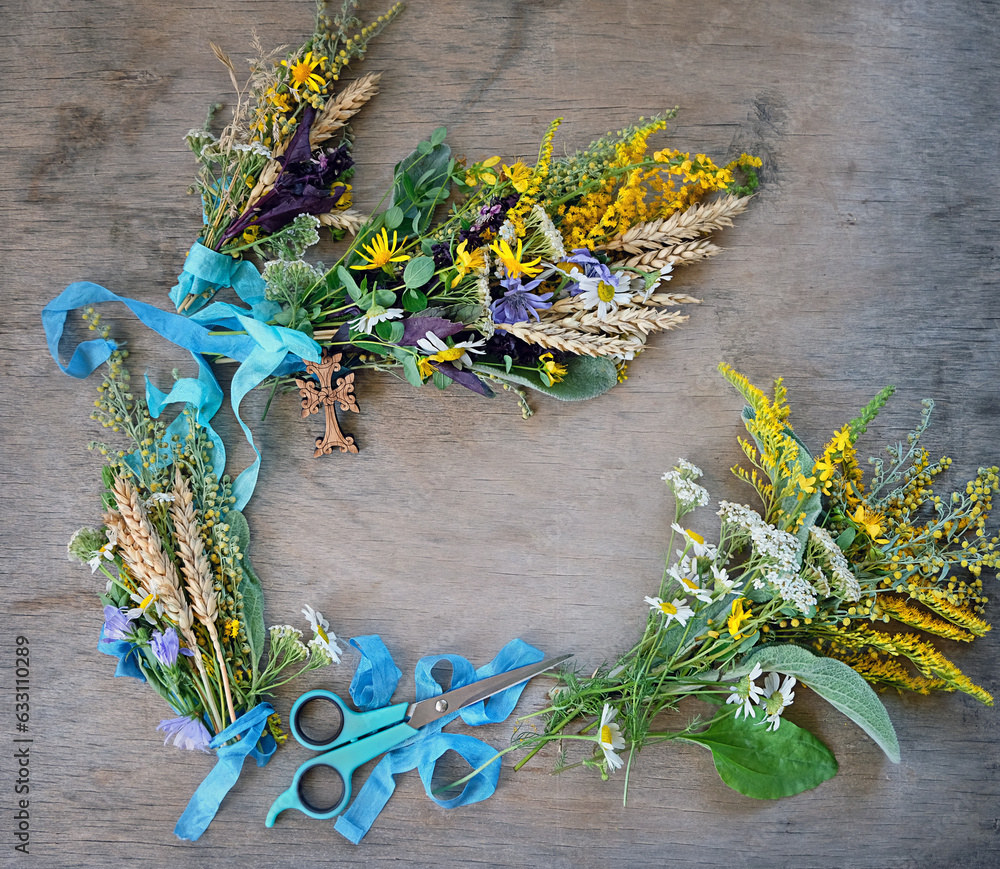 Herbs and flowers for sacred bouquets, cross, scissors, blue ribbons on ...