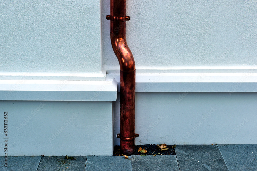 shiny new copper rain water leader, downspout or down pipe detail ...