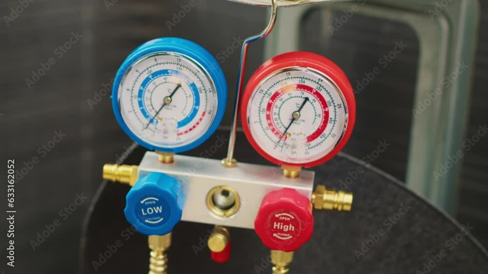 Close up shot of professional ac gauges vacuum pump used for checking ...