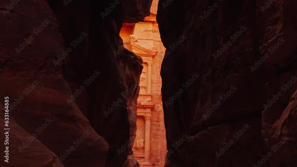 4k, view of Al-Khazneh tomb, symbol of the city of Petra, from Siq ...