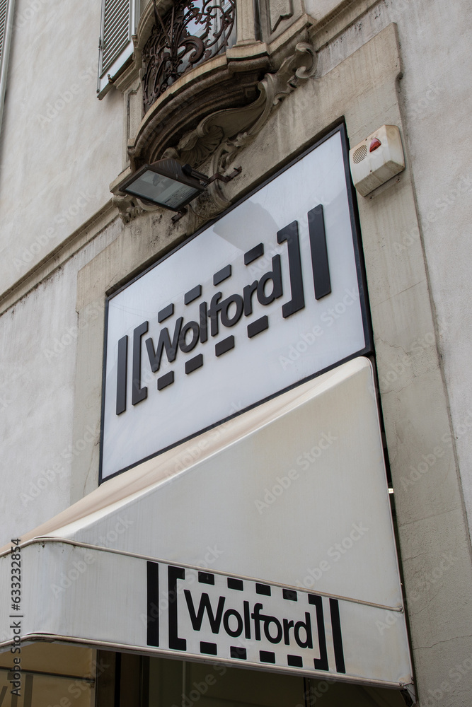 wolford brand text entrance facade store signage and logo sign on shop ...