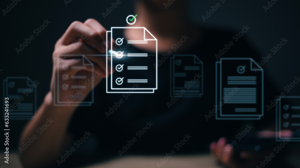 Women touching on virtual screen to tick mark documents for online ...