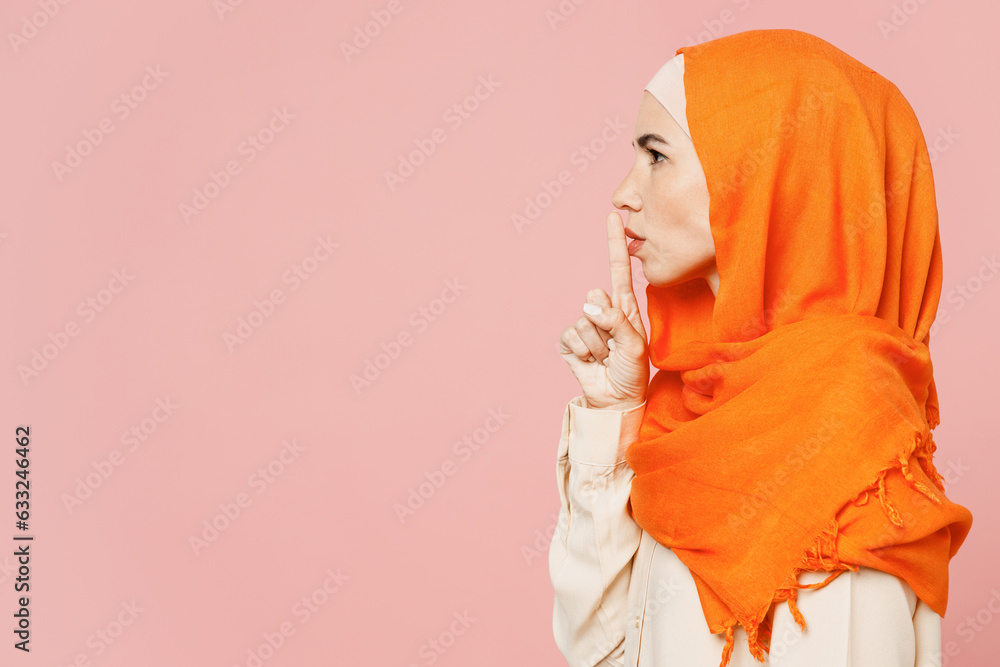 Side view young arabian asian muslim woman wearing orange abaya hijab ...