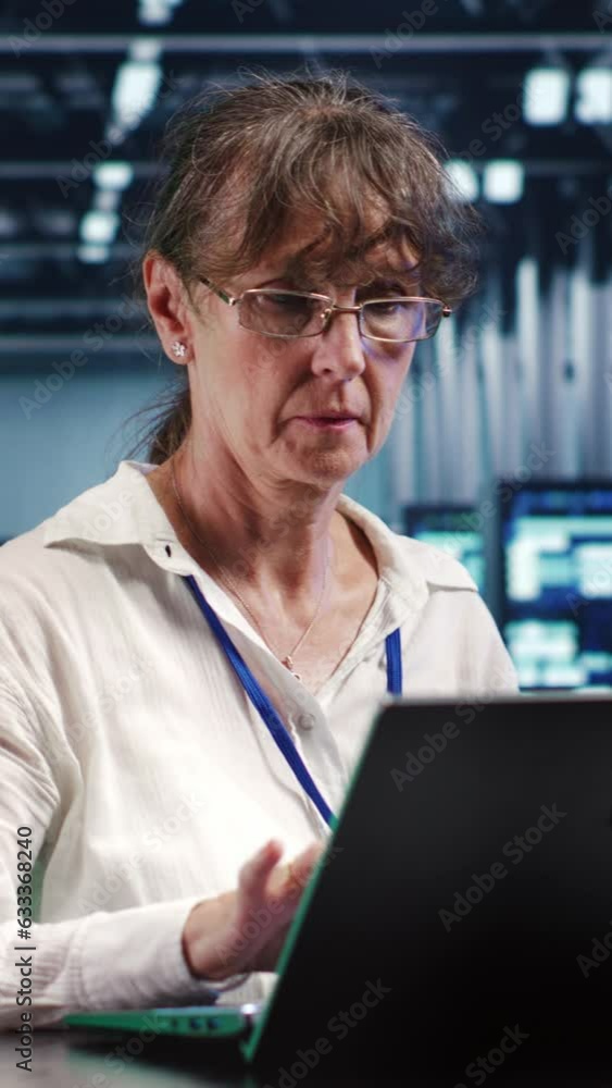 Vertical video Proficient serviceman working in high tech establishment ...