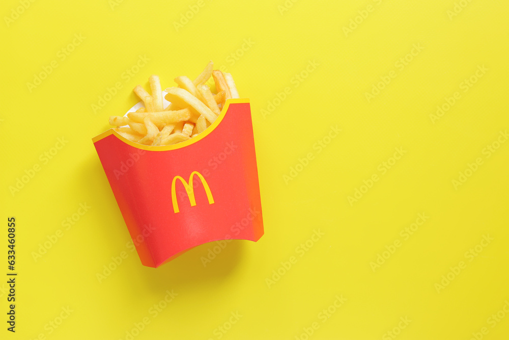 Kyiv, Ukraine - August 10, 2023: French fries on a yellow background ...