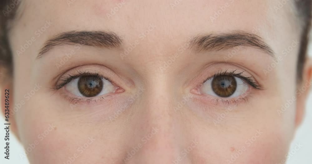 Women eyes look, frown on white background, close up. Cropped face ...