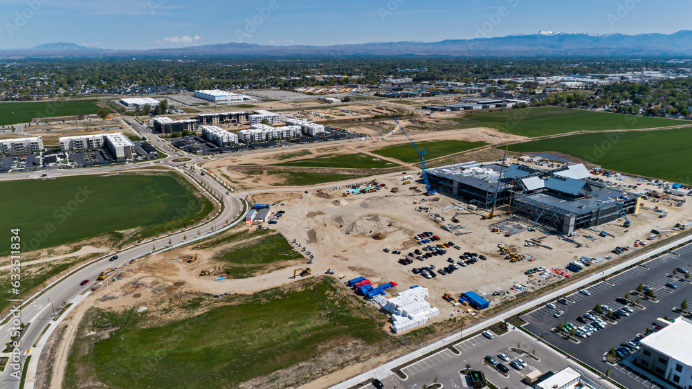 Commercial construction site with cranes, equipment, future ...