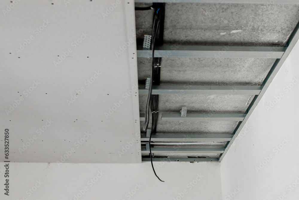 Structure with profiles and plasterboard for installation of suspended ...