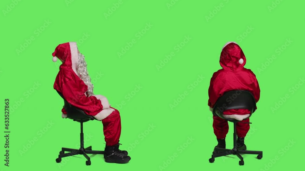 Father christmas cosplay sit on chair, looking around studio and ...