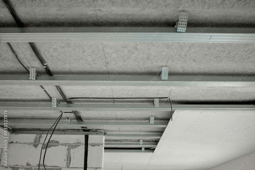 Suspended ceiling structure with profiles for installation of ceiling ...