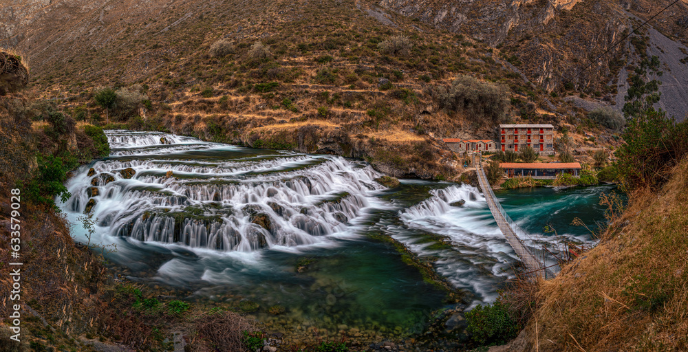 Emerald green waterfalls in the town of Huancaya, a very touristic ...