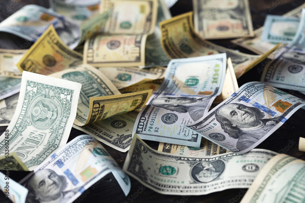 Money, US dollar bills background. Money scattered on the desk ...