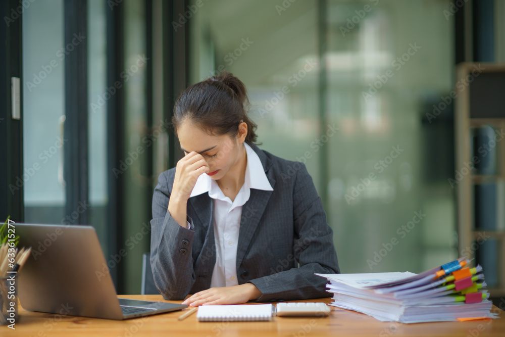 Overworked stressed Asian businesswoman employee holding glasses ...