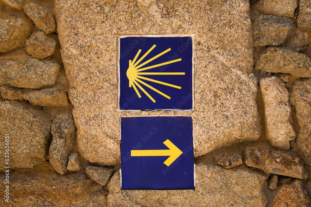 Vertical sign marking the direction to follow on the road to Santiago ...