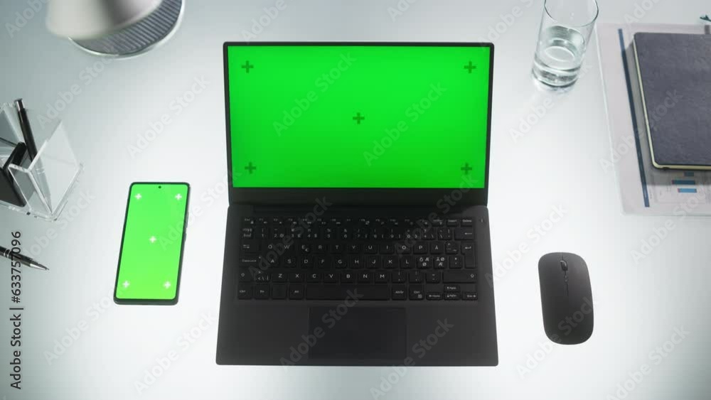 Top Down View of a Laptop Computer with Mock Up Green Screen Standing ...