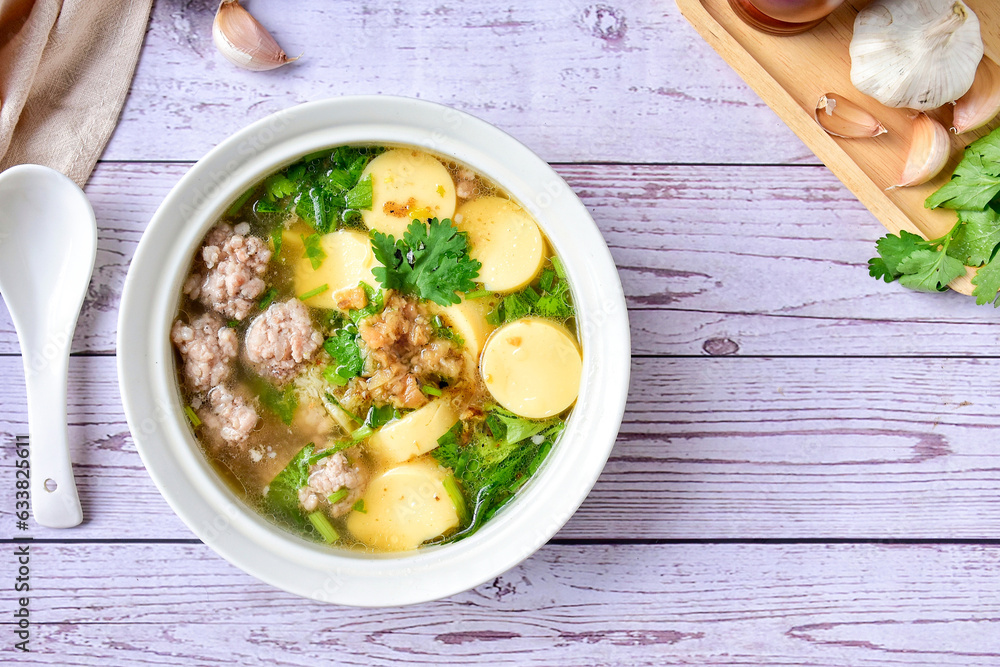 Clear Soup with Egg Tofu ,vegetable and Minced Pork ball ,top view ...