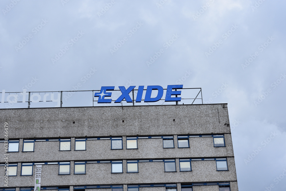 Exide signage, logo on the building facade. Storage battery ...