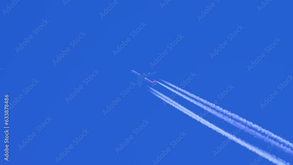 Jet aircraft plane with a bright white contrail at blue sky. Aeroplane vapour, Contrails ...
