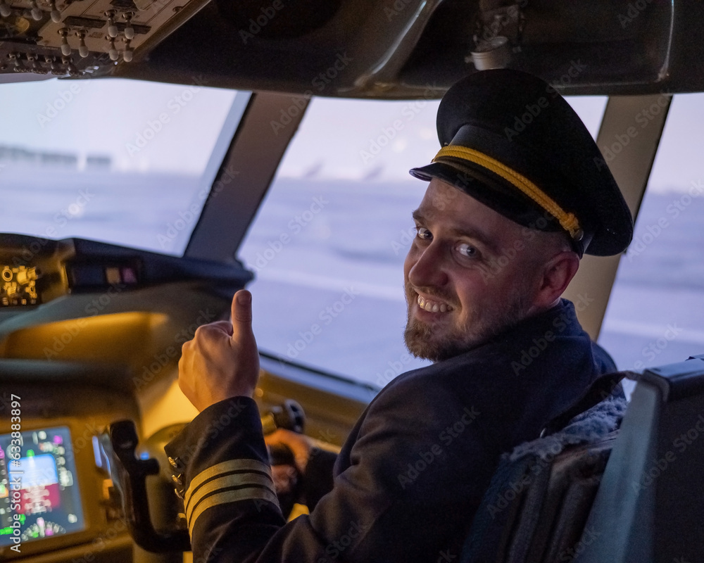 Caucasian bearded man smiling while driving a flight simulator. Pilot ...