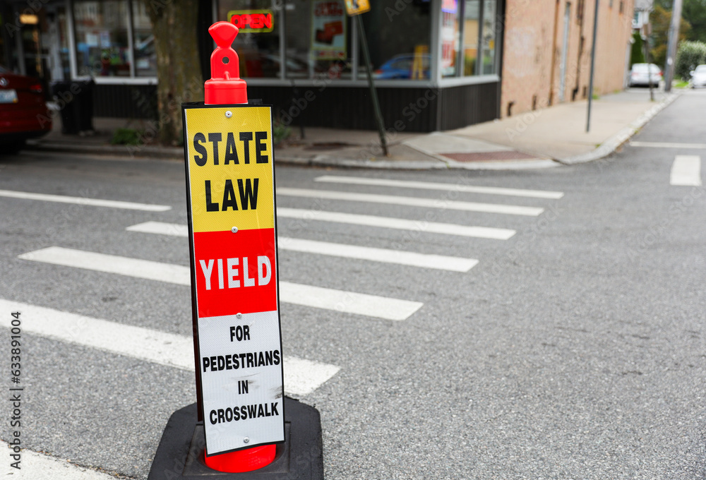 yellow pedestrian sign, a universal symbol of safety and shared space ...