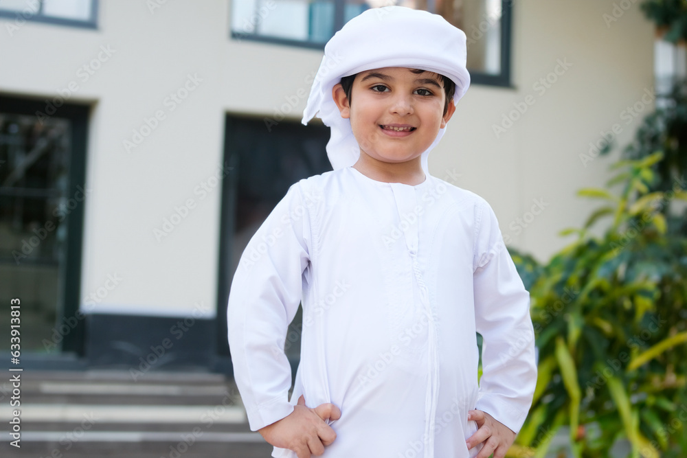 Foto de Arab Emirati student outside school campus. Middle Eastern boy ...