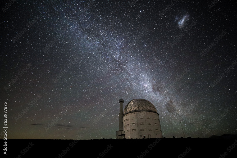 Milky way galaxy in the night sky above telescope in Sutherland, South ...