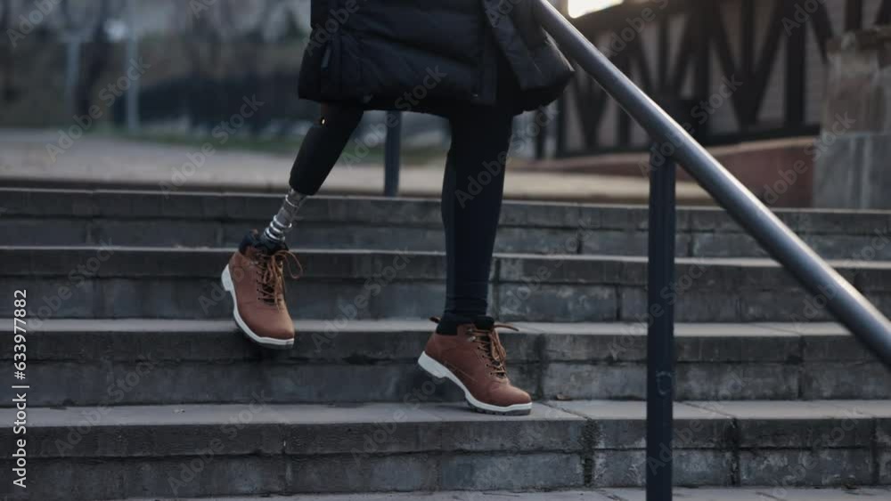 Disabled man, Prosthetic leg, Staircase descent. Disabled man with ...