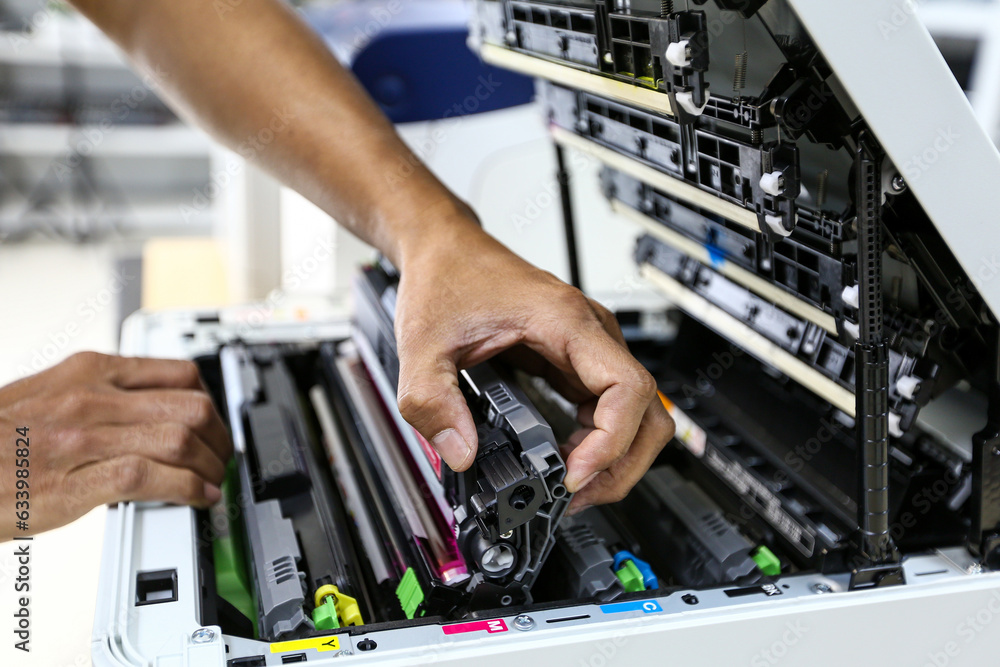 Foto de Technician hand open cover photocopier or photocopy to fix ...