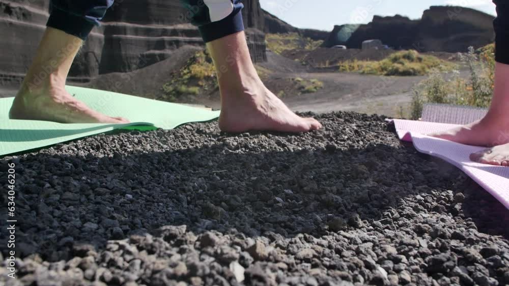 The foot of the male sadha nail guru will level the small stones for ...