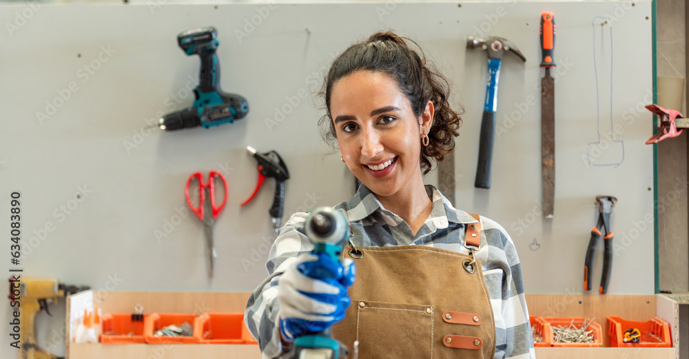 One Strong confident young aged women carpenter standing look at camera ...