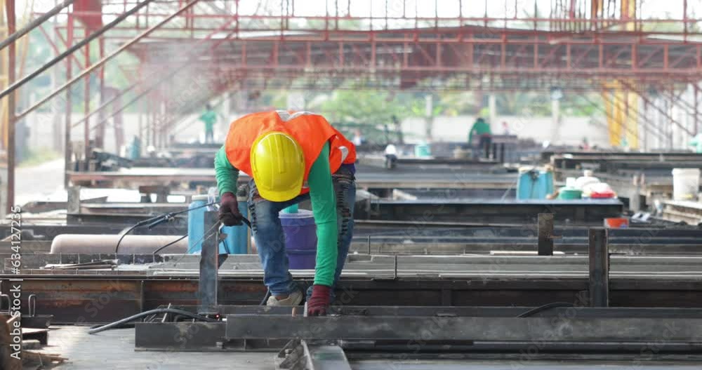 welding. Asian man worker weld metal with a arc welding machine at the ...