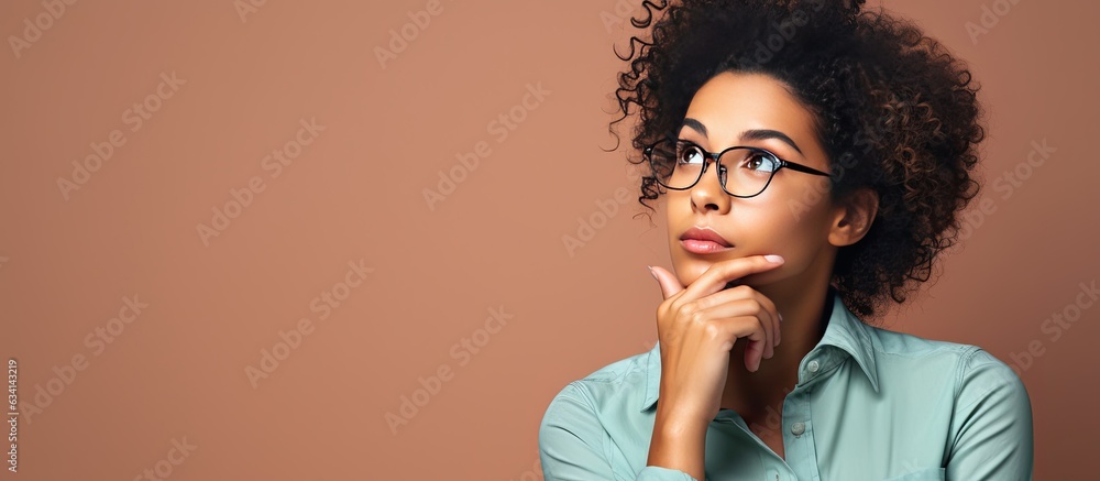 Confused young black woman reflecting deeply on business concept ...