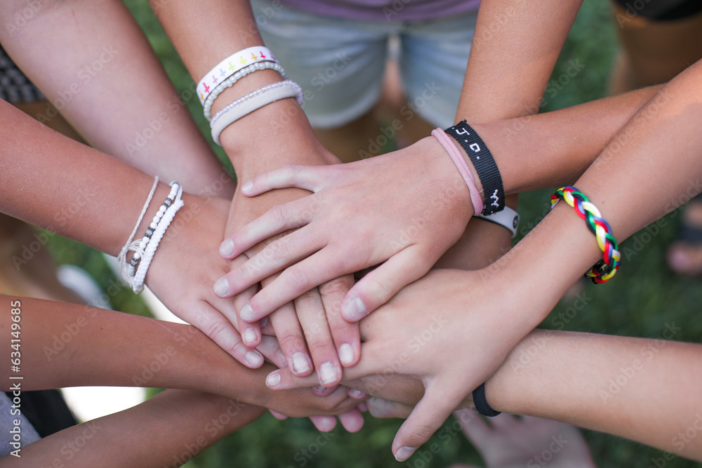 Foto de Team of children put hands together.Peaceful Protest kids group ...