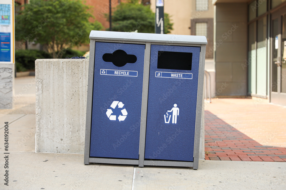 Trashcan on city street symbolizes urban disposal, waste management ...