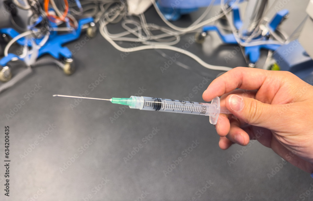 Hospital tools like syringes, drugs, and IV fluids encapsulate healing ...