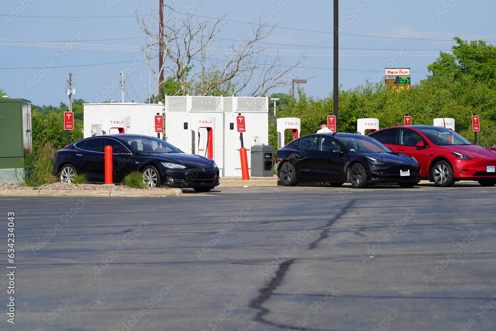 EV electric vehicles charging at Tesla charging stations. Stock Photo ...